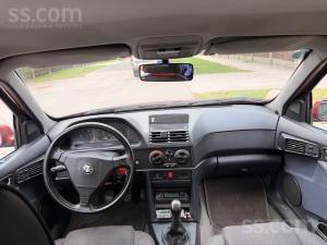 Red Alfa Romeo 146 1996 in Riga, with an engine capacity of 2.00 L and mileage of 224 thousand km for 2900 €, photo 9 on AUTOMOTO.COM.LV