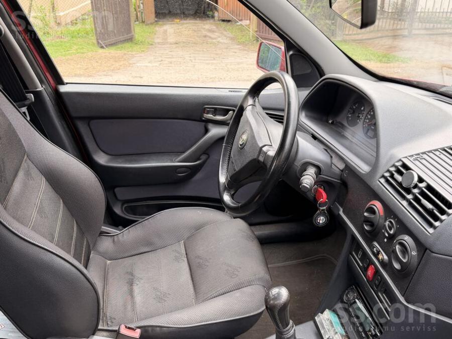 Red Alfa Romeo 146 1996 in Riga, with an engine capacity of 2.00 L and mileage of 224 thousand km for 2900 €, photo 11 on AUTOMOTO.COM.LV