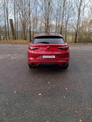 Red Alfa Romeo Stelvio 2023 in Plunge, with an engine capacity of 2.00 L and mileage of 12 thousand km for 29900 €, photo 5 on AUTOMOTO.COM.LV
