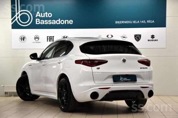 White Alfa Romeo Stelvio 2023 in Riga, with an engine capacity of 2.00 L and mileage of 20 thousand km for 44490 €, photo 8 on AUTOMOTO.COM.LV