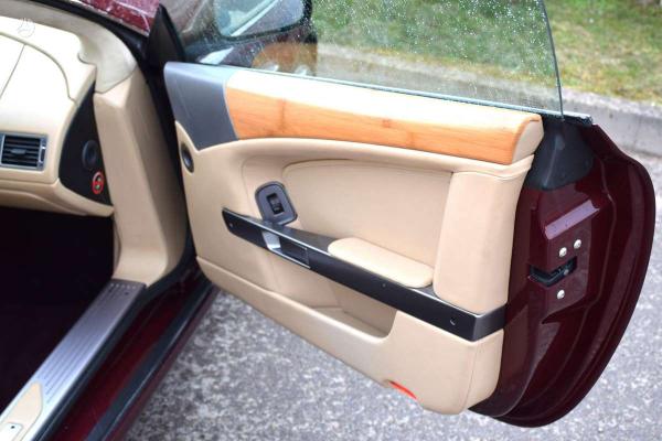 Red Aston Martin DB9 2005 in Klaipeda, with an engine capacity of 5.94 L and mileage of 106 thousand km for 34900 €, photo 8 on AUTOMOTO.COM.LV