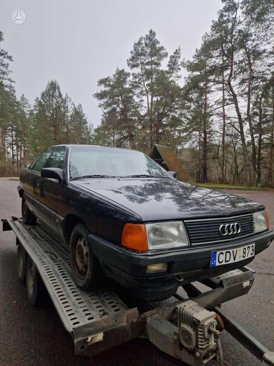 Black Audi 100 1988 in Panevezys, with an engine capacity of 1.99 L and mileage of 246 thousand km for 650 €, photo 1 on AUTOMOTO.COM.LV