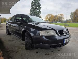 Melns Audi A6 1998 Ogre, ar dzinēja tilpumu 2.40 L un nobraukumu 253 tūkst. km par 2000 €, foto  vietnē AUTOMOTO.COM.LV