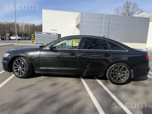 Black Audi A6 2011 in Riga, with an engine capacity of 3.00 L and mileage of 311 thousand km for 7950 €, photo 7 on AUTOMOTO.COM.LV