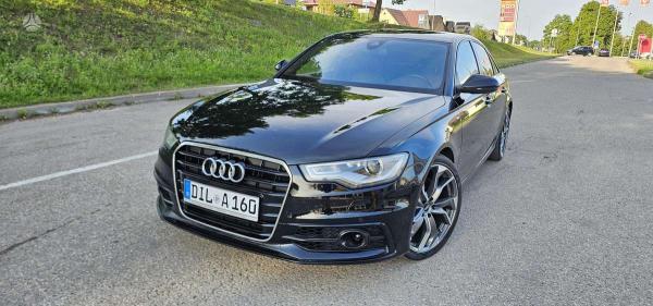 Black Audi A6 2012 in Jonava, with an engine capacity of 2.97 L and mileage of 290 thousand km for 7199 €, photo 1 on AUTOMOTO.COM.LV