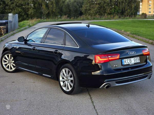 Audi A6 2013 in Radviliskis on AUTOMOTO.COM.LV Black Audi A6 2013 in Radviliskis, with an engine capacity of 1.98 L and mileage of 243 thousand km for 7300 €, photo 5 on AUTOMOTO.COM.LV