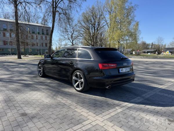 Black Audi A6 2012 in Jelgava, with an engine capacity of 3.00 L and mileage of 289 thousand km for 10990 €, photo 3 on AUTOMOTO.COM.LV