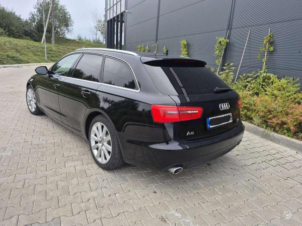 Audi A6 2013 in Vilnius on AUTOMOTO.COM.LV Black Audi A6 2013 in Vilnius, with an engine capacity of 2.97 L and mileage of 230 thousand km for 10000 €, photo 6 on AUTOMOTO.COM.LV