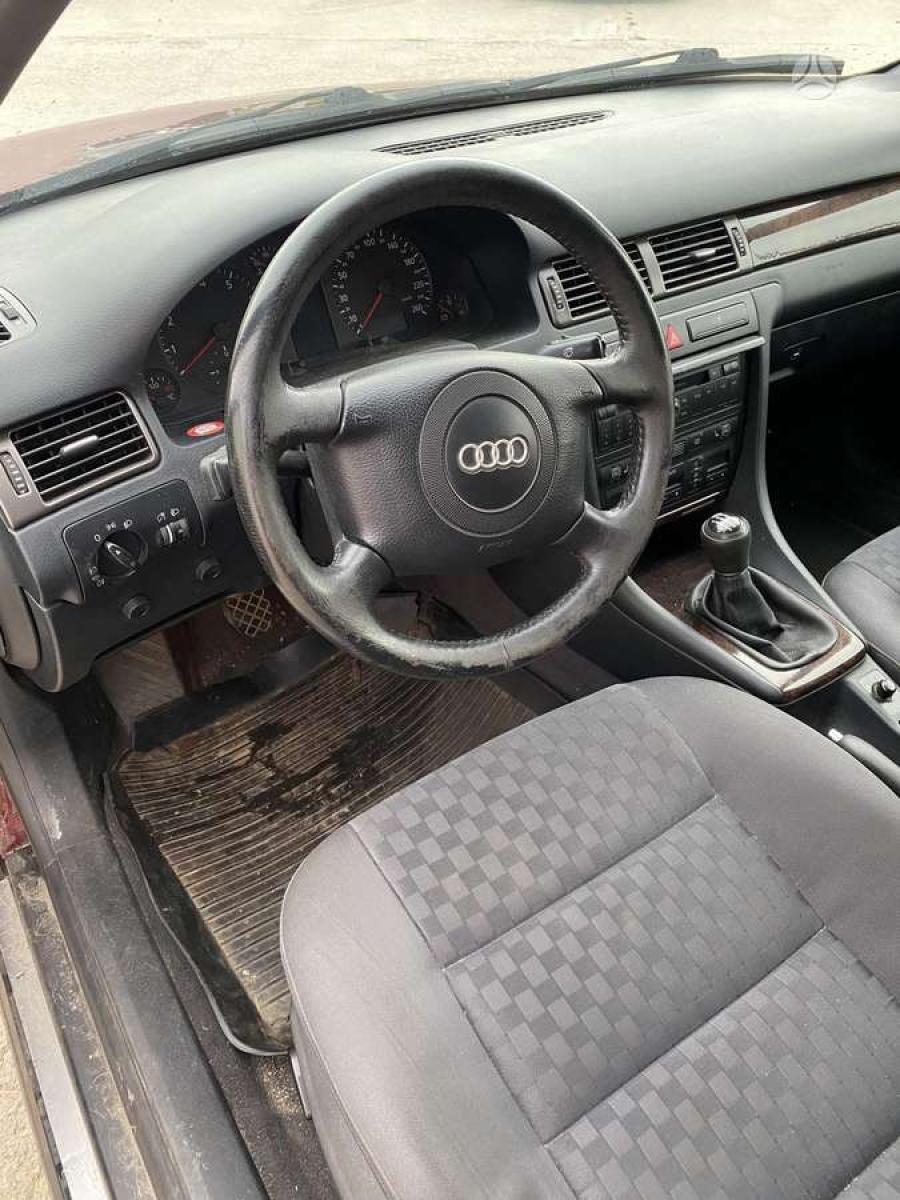 Red Audi A6 1998 in Vilnius, with an engine capacity of 2.39 L and mileage of 304 thousand km for 899 €, photo 6 on AUTOMOTO.COM.LV