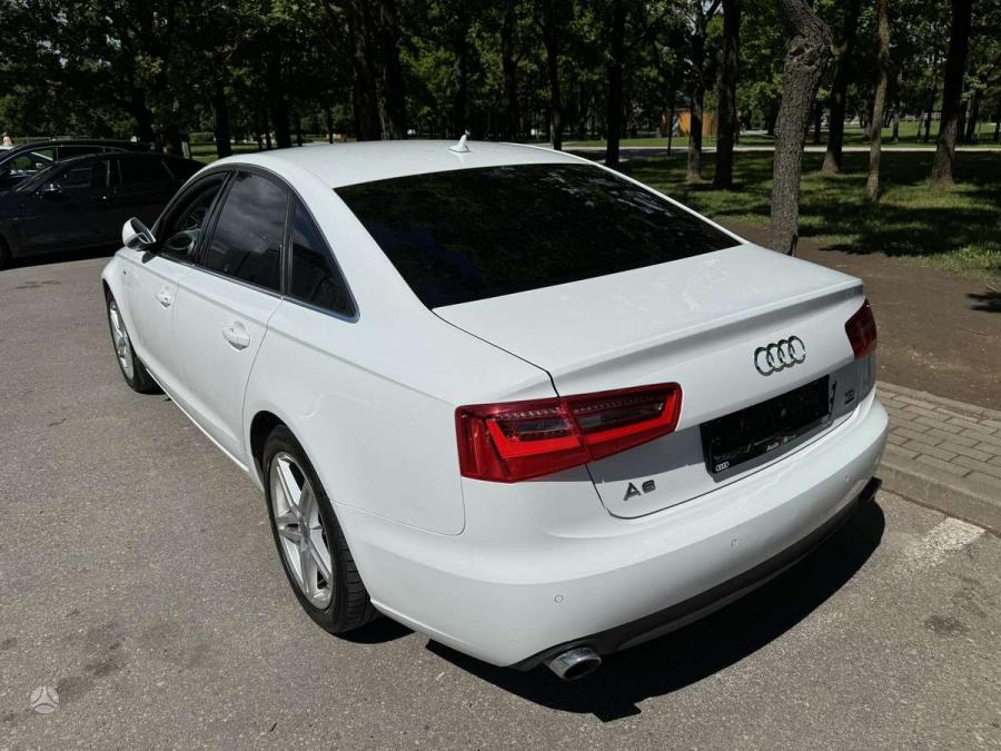 White Audi A6 2013 in Kaunas, with an engine capacity of 3.00 L and mileage of 289 thousand km for 9090 €, photo 5 on AUTOMOTO.COM.LV