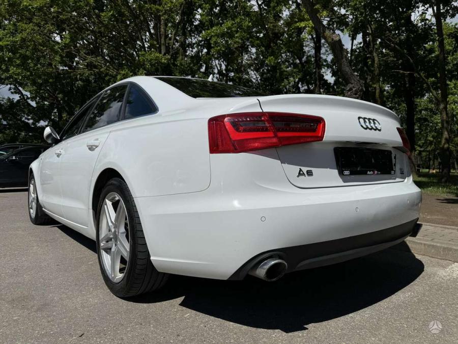 White Audi A6 2013 in Kaunas, with an engine capacity of 3.00 L and mileage of 289 thousand km for 9090 €, photo 6 on AUTOMOTO.COM.LV