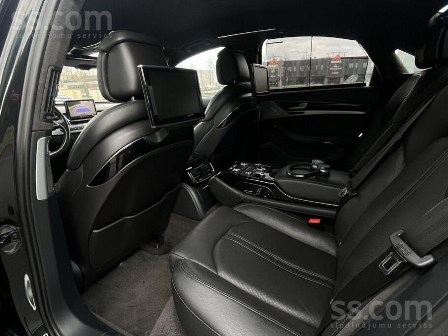 Black Audi A8 2011 in Riga, with an engine capacity of 4.20 L and mileage of 194 thousand km for 16490 €, photo 12 on AUTOMOTO.COM.LV