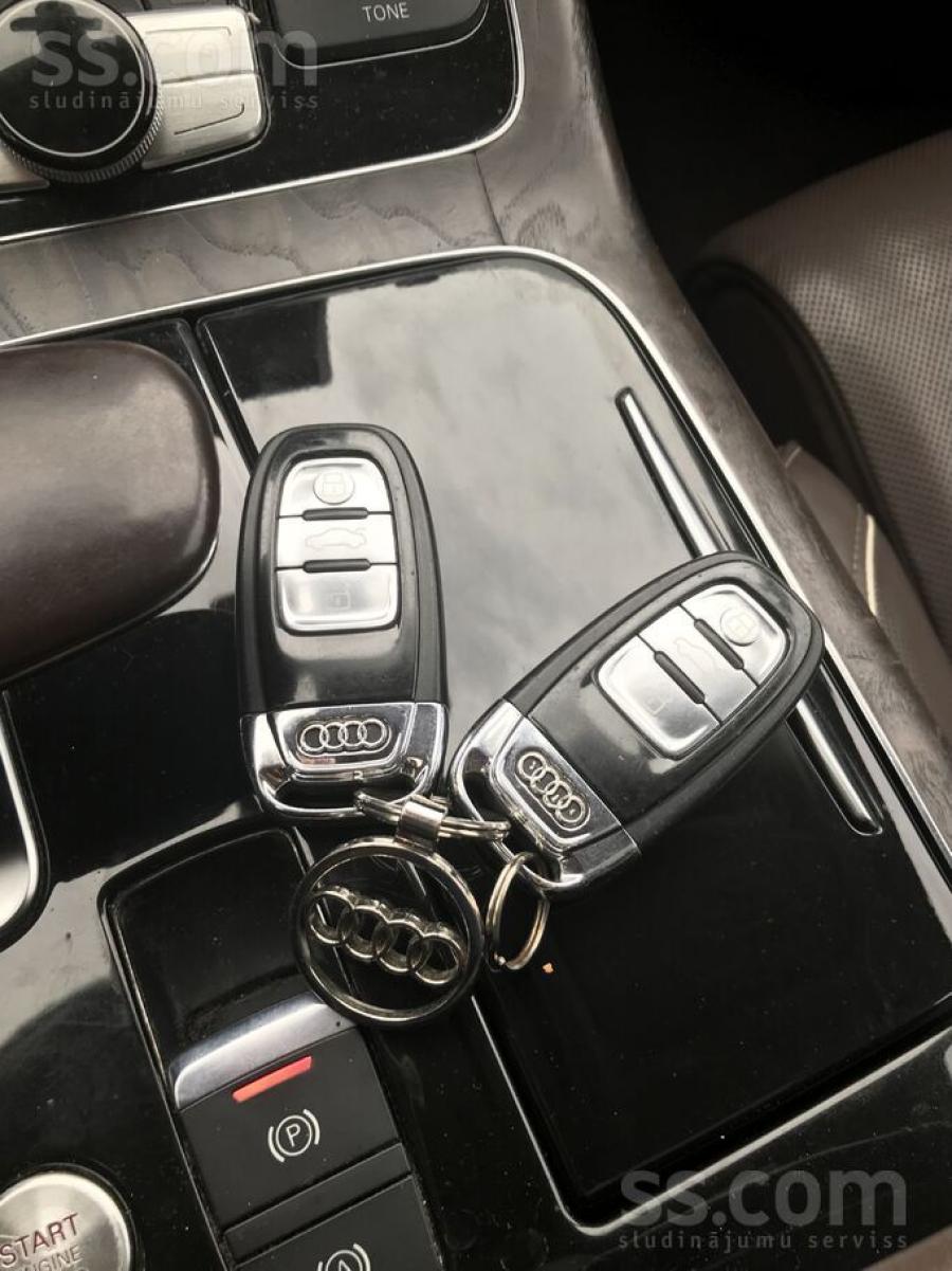 Black Audi A8 2011 in Riga, with an engine capacity of 3.00 L and mileage of 340 thousand km for 12500 €, photo 26 on AUTOMOTO.COM.LV