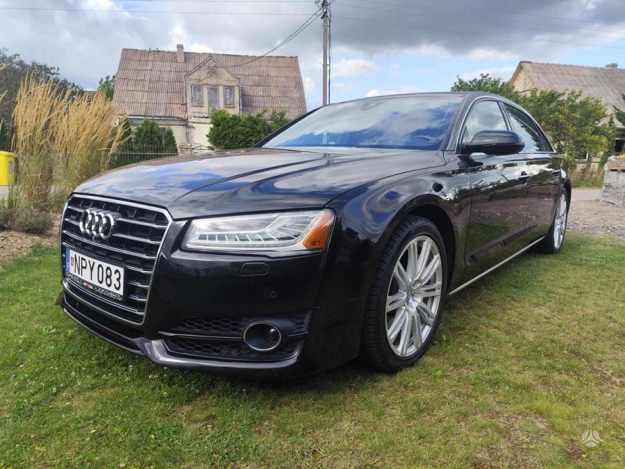 Black Audi A8 2015 in Vilnius, with an engine capacity of 4.00 L and mileage of 116 thousand km for 21999 €, photo 1 on AUTOMOTO.COM.LV