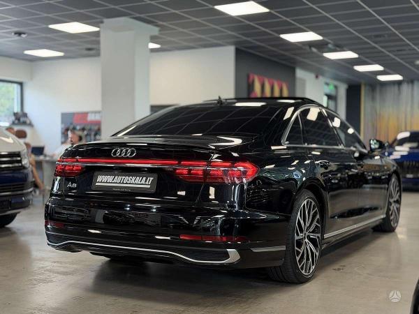 Black Audi A8 2023 in Klaipeda, with an engine capacity of 2.97 L and mileage of 129 thousand km for 69900 €, photo 4 on AUTOMOTO.COM.LV