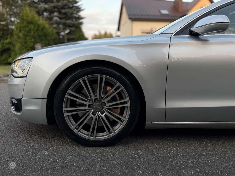 Grey Audi A8 2014 in Vilnius, with an engine capacity of 4.13 L and mileage of 280 thousand km for 11950 €, photo 14 on AUTOMOTO.COM.LV