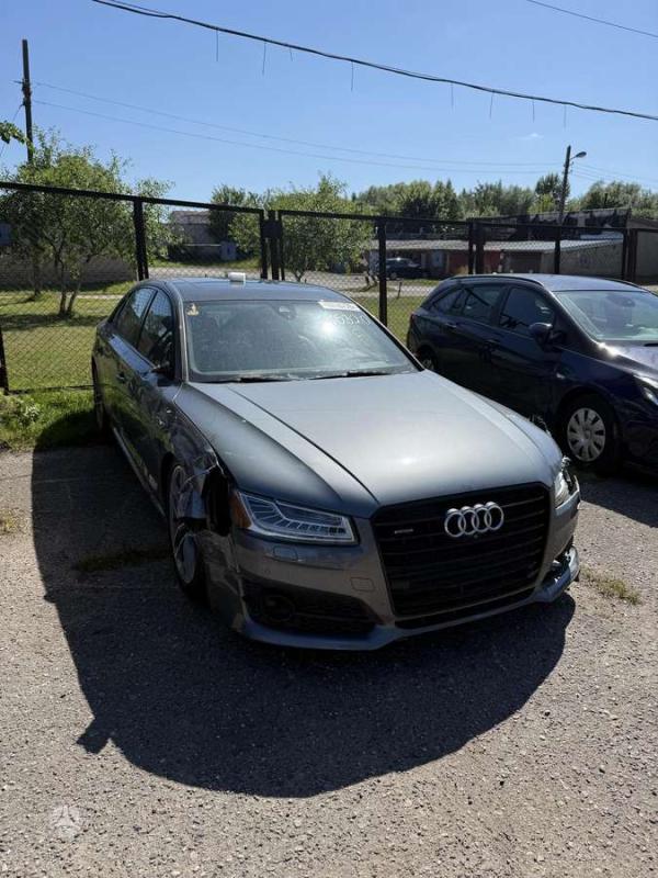 Grey Audi A8 2017 in Klaipeda, with an engine capacity of 3.00 L and mileage of 143 thousand km for 8499 €, photo 1 on AUTOMOTO.COM.LV