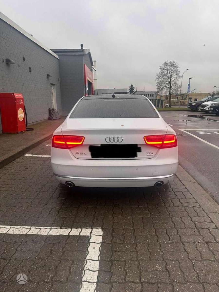 White Audi A8 2014 in Vilnius, with an engine capacity of 3.00 L and mileage of 240 thousand km for 1950 €, photo 3 on AUTOMOTO.COM.LV
