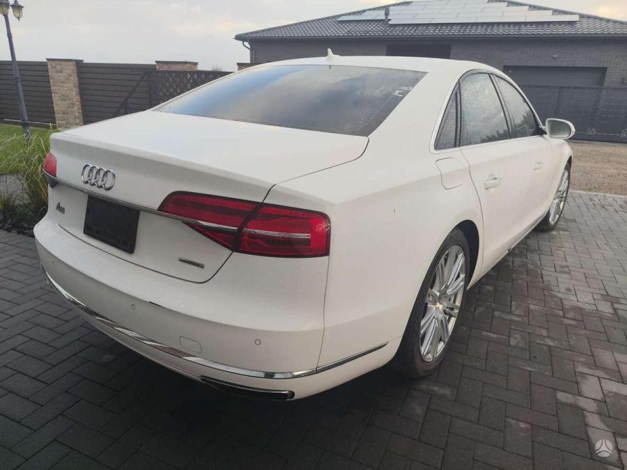 White Audi A8 2015 in Taurage, with an engine capacity of 3.00 L and mileage of 234 thousand km for 8200 €, photo 13 on AUTOMOTO.COM.LV