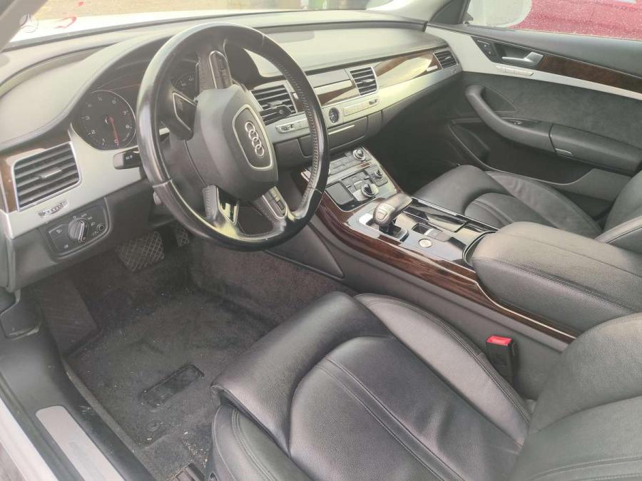White Audi A8 2015 in Taurage, with an engine capacity of 3.00 L and mileage of 234 thousand km for 8200 €, photo 15 on AUTOMOTO.COM.LV