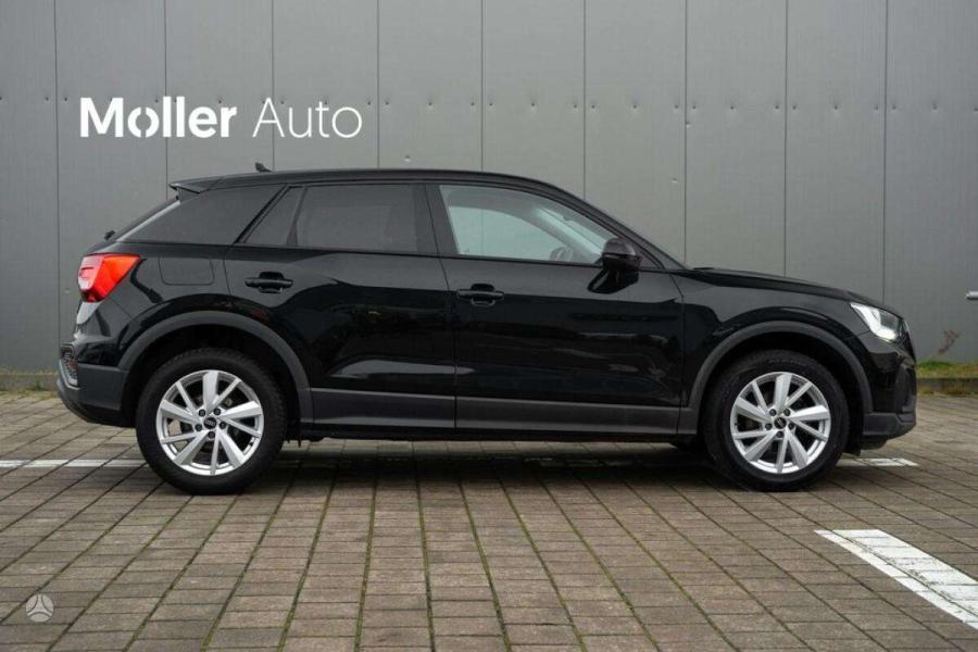 Black Audi Q2 2022 in Vilnius, with an engine capacity of 1.50 L and mileage of 49 thousand km for 23900 €, photo 7 on AUTOMOTO.COM.LV