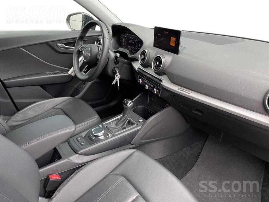 Black Audi Q2 2024 in Riga, with an engine capacity of 1.50 L and mileage of 82 thousand km for 22990 €, photo 7 on AUTOMOTO.COM.LV