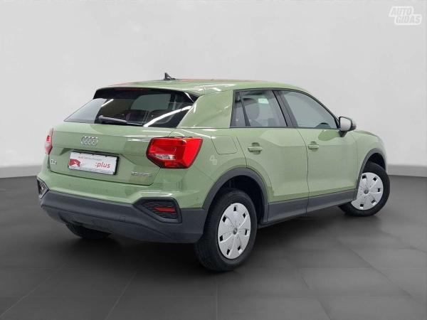 Green Audi Q2 2023 in Kaunas, with an engine capacity of 1.50 L and mileage of 31 thousand km for 27396 €, photo 3 on AUTOMOTO.COM.LV