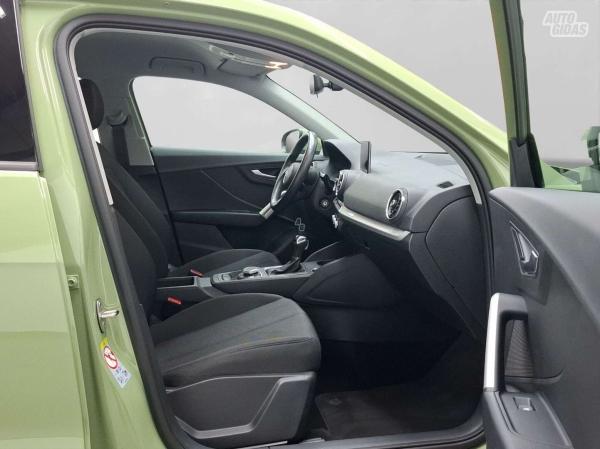 Green Audi Q2 2023 in Kaunas, with an engine capacity of 1.50 L and mileage of 31 thousand km for 27396 €, photo 4 on AUTOMOTO.COM.LV
