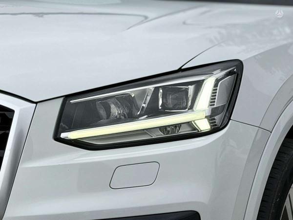 White Audi Q2 2016 in Taurage, with an engine capacity of 1.60 L and mileage of 158 thousand km for 11800 €, photo 7 on AUTOMOTO.COM.LV