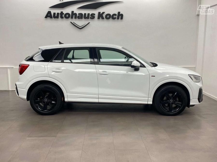 White Audi Q2 2023 in Kaunas, with an engine capacity of 2.00 L and mileage of 39 thousand km for 27878 €, photo 2 on AUTOMOTO.COM.LV