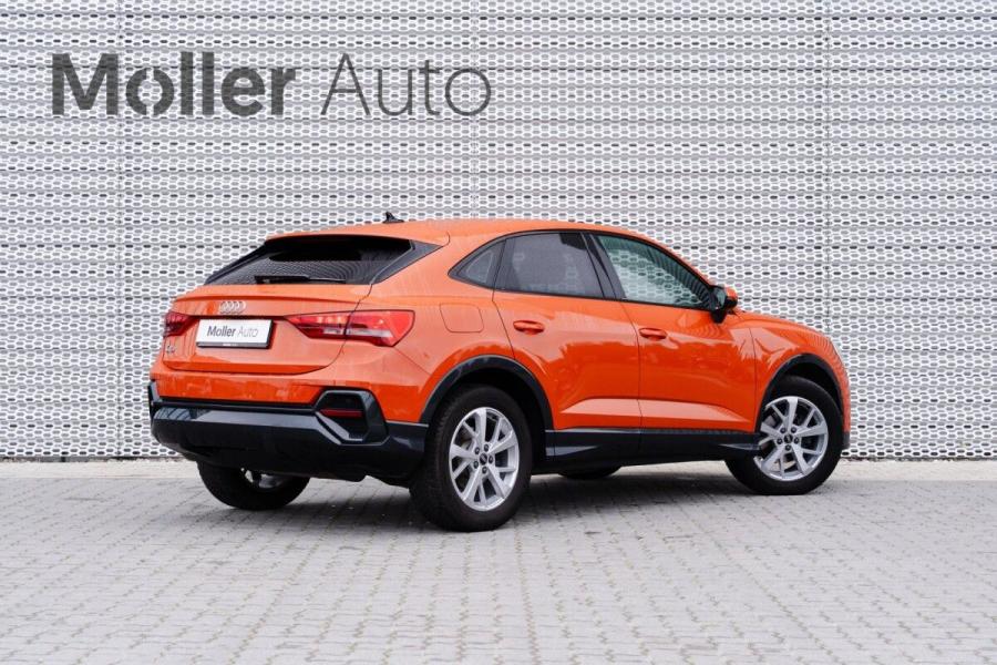 Orange Audi Q3 2023 in Marupe, with an engine capacity of 1.50 L and mileage of 70 thousand km for 27900 €, photo 5 on AUTOMOTO.COM.LV