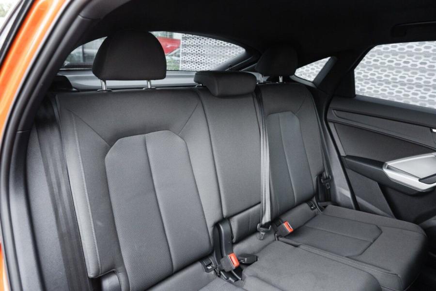 Orange Audi Q3 2023 in Marupe, with an engine capacity of 1.50 L and mileage of 70 thousand km for 27900 €, photo 26 on AUTOMOTO.COM.LV