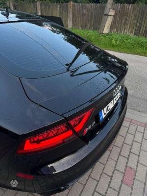 Black Audi RS7 2014 in Riga, with an engine capacity of 3.99 L and mileage of 160 thousand km for 29800 €, photo 5 on AUTOMOTO.COM.LV