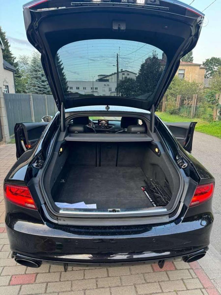 Black Audi RS7 2014 in Riga, with an engine capacity of 3.99 L and mileage of 160 thousand km for 29800 €, photo 18 on AUTOMOTO.COM.LV