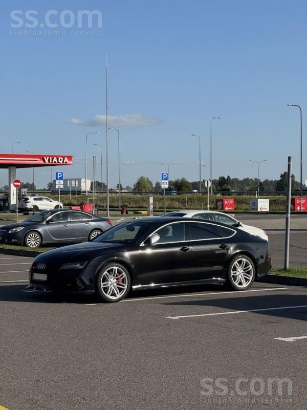 Violet Audi RS7 2014 in Riga, with an engine capacity of 4.00 L and mileage of 160 thousand km for 24499 €, photo 3 on AUTOMOTO.COM.LV