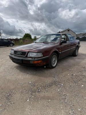 Sarkans Audi V8 1991 Marijampole, ar dzinēja tilpumu 3.56 L un nobraukumu 280 tūkst. km par 4900 €, foto  vietnē AUTOMOTO.COM.LV