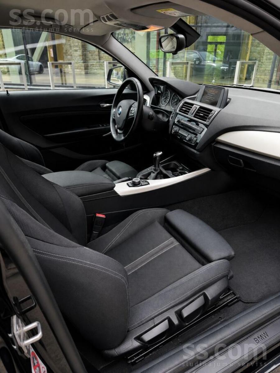Black BMW 116 2015 in Riga, with an engine capacity of 1.50 L and mileage of 138 thousand km for 8100 €, photo 6 on AUTOMOTO.COM.LV