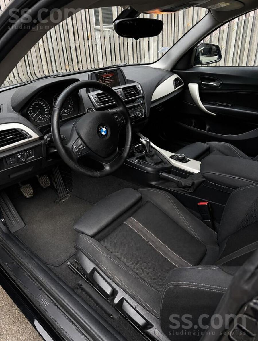 Black BMW 116 2015 in Riga, with an engine capacity of 1.50 L and mileage of 138 thousand km for 8100 €, photo 7 on AUTOMOTO.COM.LV