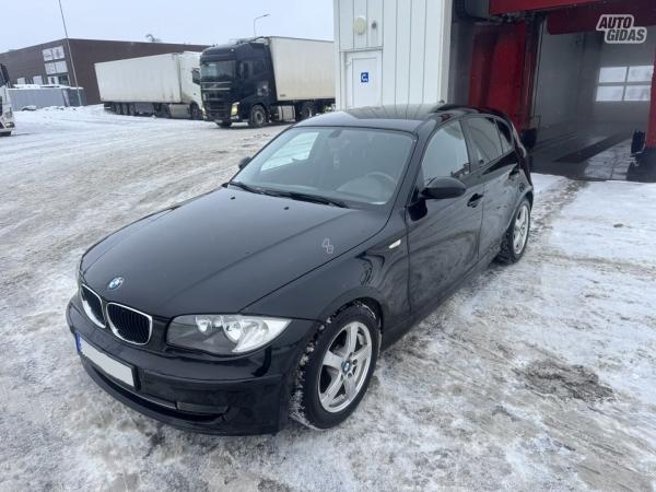 Black BMW 116 2007 in Kaunas, with an engine capacity of 2.00 L and mileage of 240 thousand km for 2150 €, photo 1 on AUTOMOTO.COM.LV