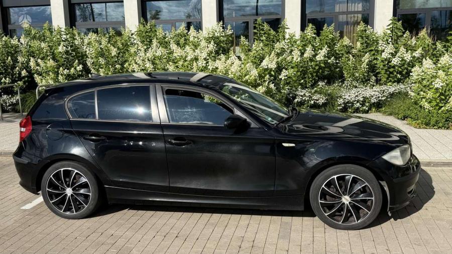 Black BMW 116 2007 in Vilnius, with an engine capacity of 1.60 L and mileage of 205 thousand km for 2000 €, photo 1 on AUTOMOTO.COM.LV
