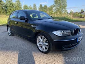 Black BMW 116 2009 in Ogre, with an engine capacity of 2.00 L and mileage of 108 thousand km for 2670 €, photo 1 on AUTOMOTO.COM.LV