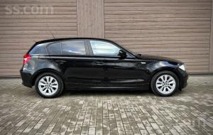 Black BMW 116 2011 in Jelgava, with an engine capacity of 2.00 L and mileage of 297 thousand km for 4150 €, photo 2 on AUTOMOTO.COM.LV