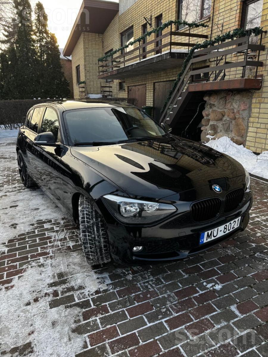 Black BMW 116 2011 in Ventspils, with an engine capacity of 2.00 L and mileage of 249 thousand km for 4299 €, photo 2 on AUTOMOTO.COM.LV