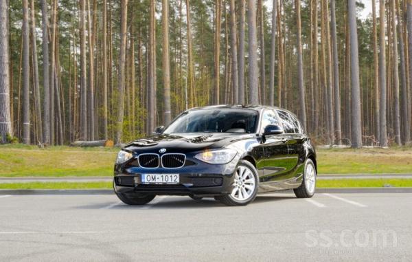 Black BMW 116 2011 in Riga, with an engine capacity of 2.00 L and mileage of 267 thousand km for 5990 €, photo 4 on AUTOMOTO.COM.LV