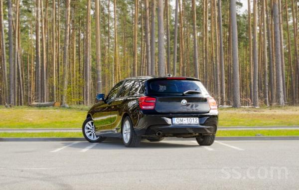 Black BMW 116 2011 in Riga, with an engine capacity of 2.00 L and mileage of 267 thousand km for 5990 €, photo 8 on AUTOMOTO.COM.LV