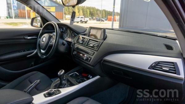 Black BMW 116 2011 in Riga, with an engine capacity of 2.00 L and mileage of 267 thousand km for 5190 €, photo 10 on AUTOMOTO.COM.LV