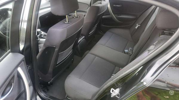 Black BMW 116 2011 in Ignalina, with an engine capacity of 1.60 L and mileage of 180 thousand km for 3299 €, photo 6 on AUTOMOTO.COM.LV