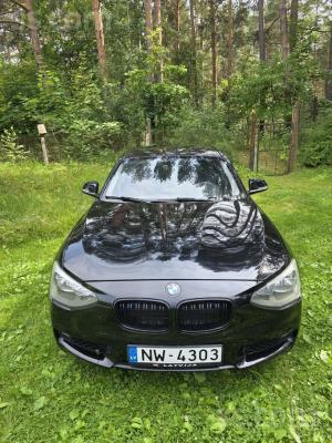 Black BMW 116 2011 in Riga, with an engine capacity of 1.60 L and mileage of 234 thousand km for 6500 €, photo  on AUTOMOTO.COM.LV