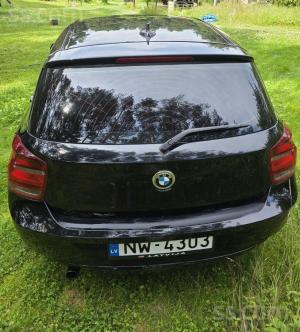 Black BMW 116 2011 in Riga, with an engine capacity of 1.60 L and mileage of 234 thousand km for 6500 €, photo 3 on AUTOMOTO.COM.LV