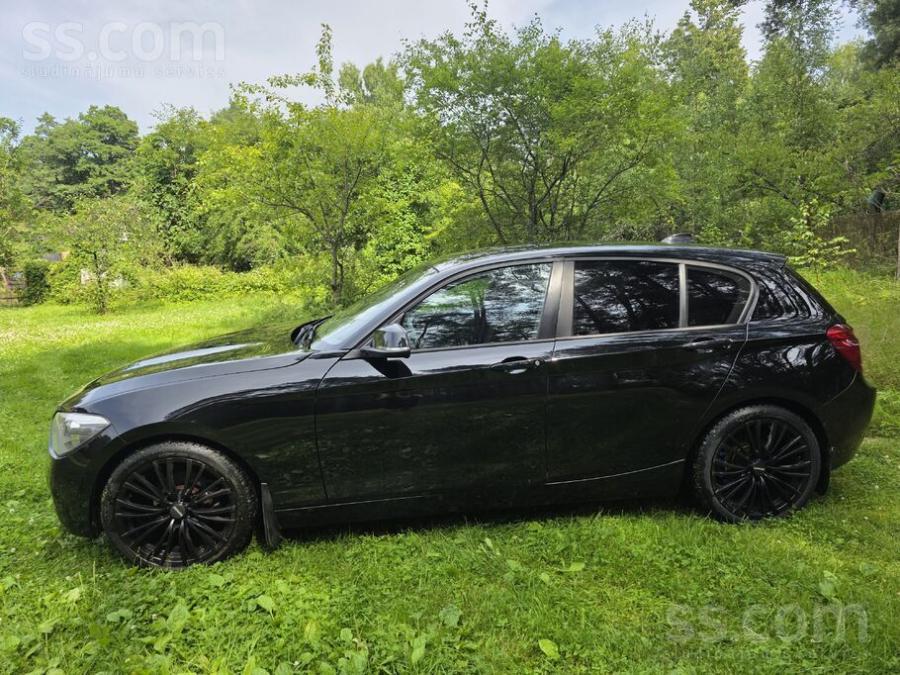Black BMW 116 2011 in Riga, with an engine capacity of 1.60 L and mileage of 234 thousand km for 6500 €, photo 4 on AUTOMOTO.COM.LV